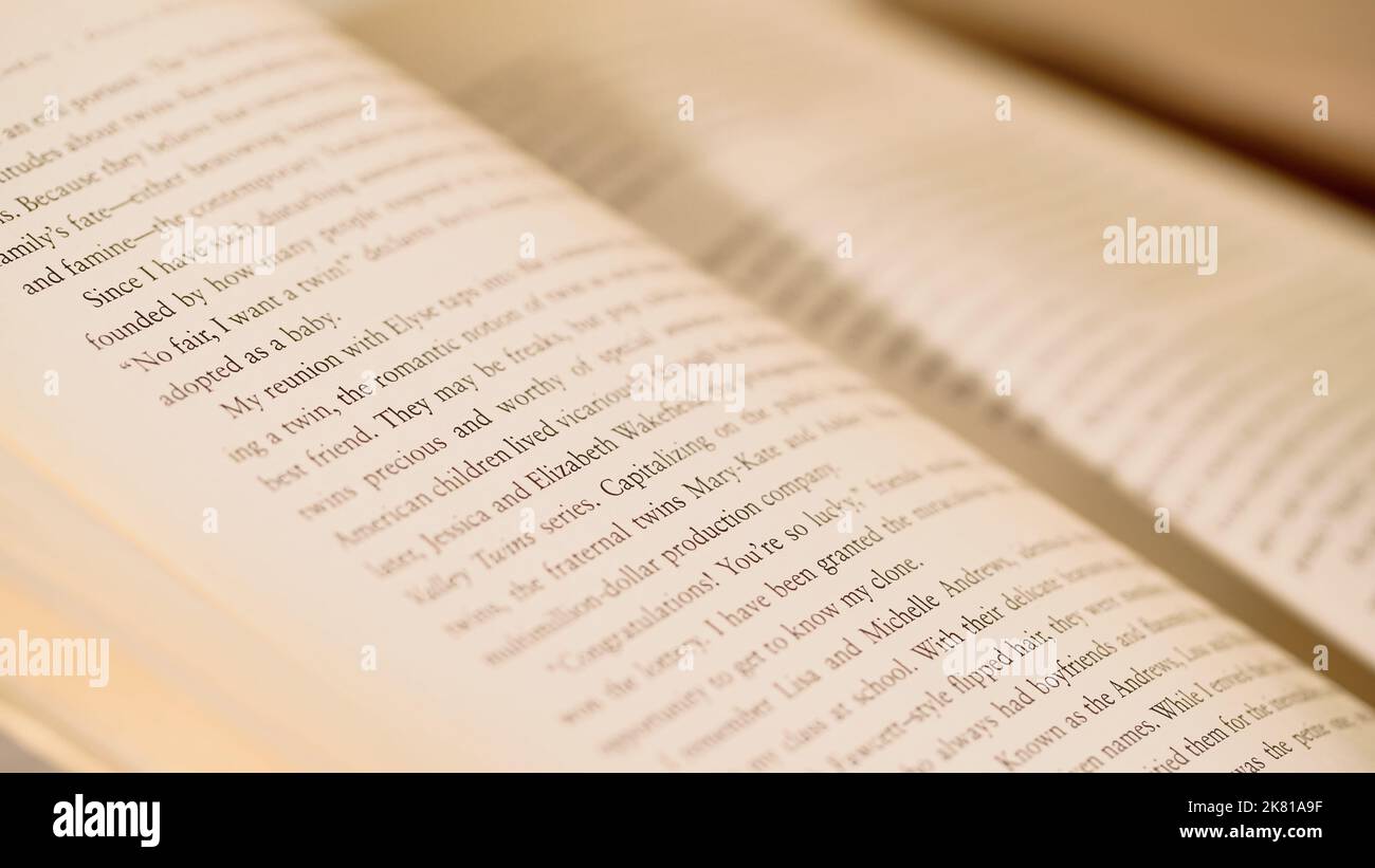 Close up view of open book with blurred pages at background,stock image ...