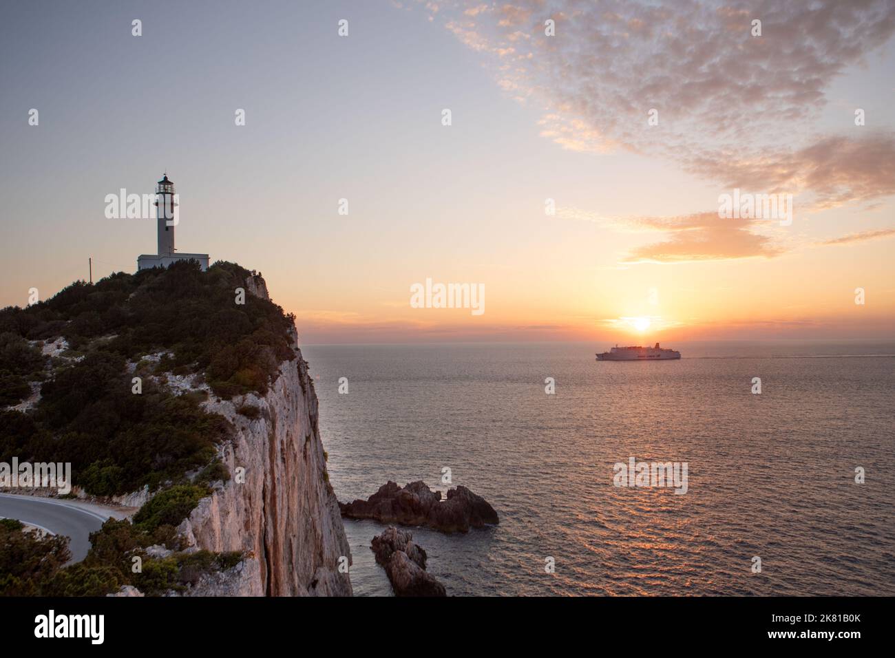 Lefkada island lighthouse ship on the horizon sunset above the sea ...