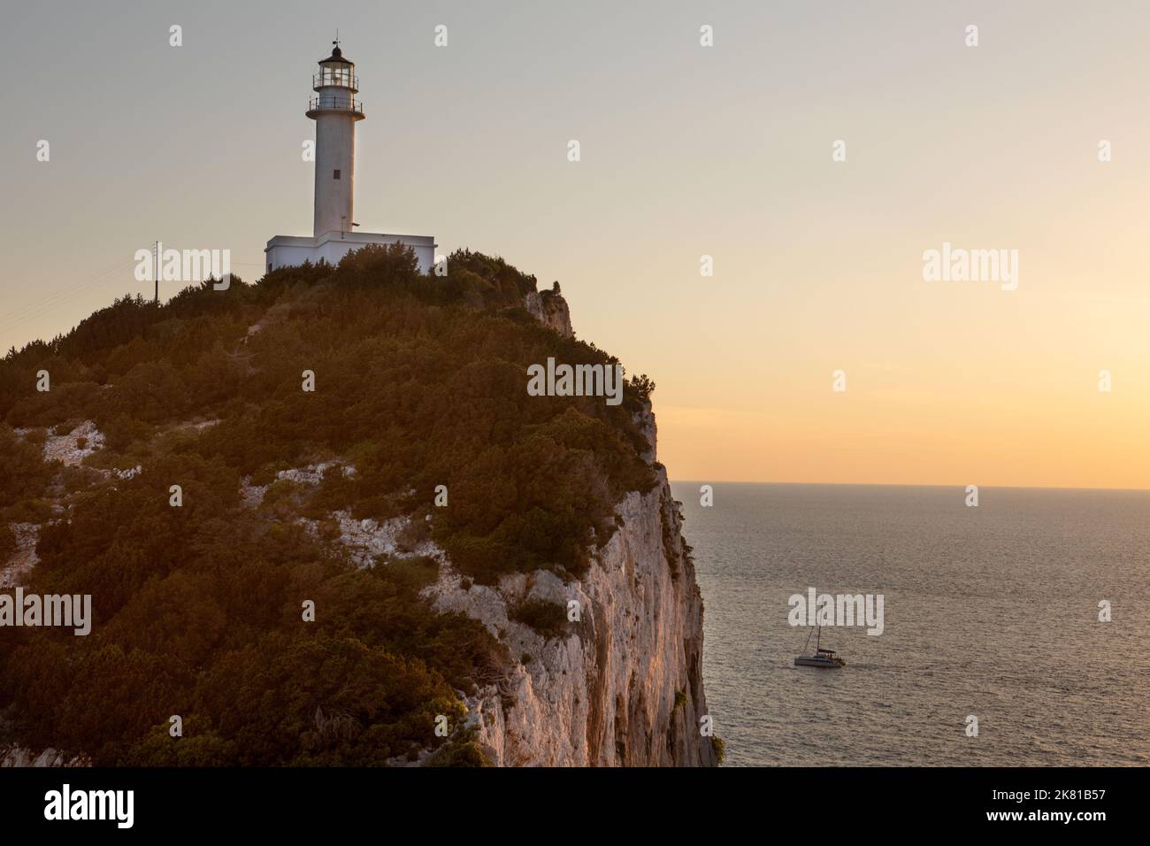 lefkada island lighthouse on the sunset Stock Photo - Alamy