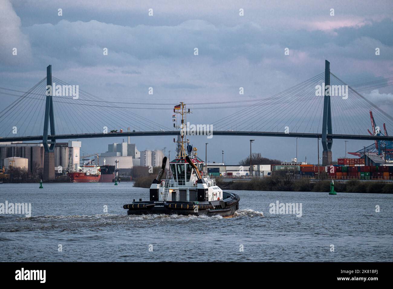 A Tugboat is driving to a Bridge Stock Photo - Alamy