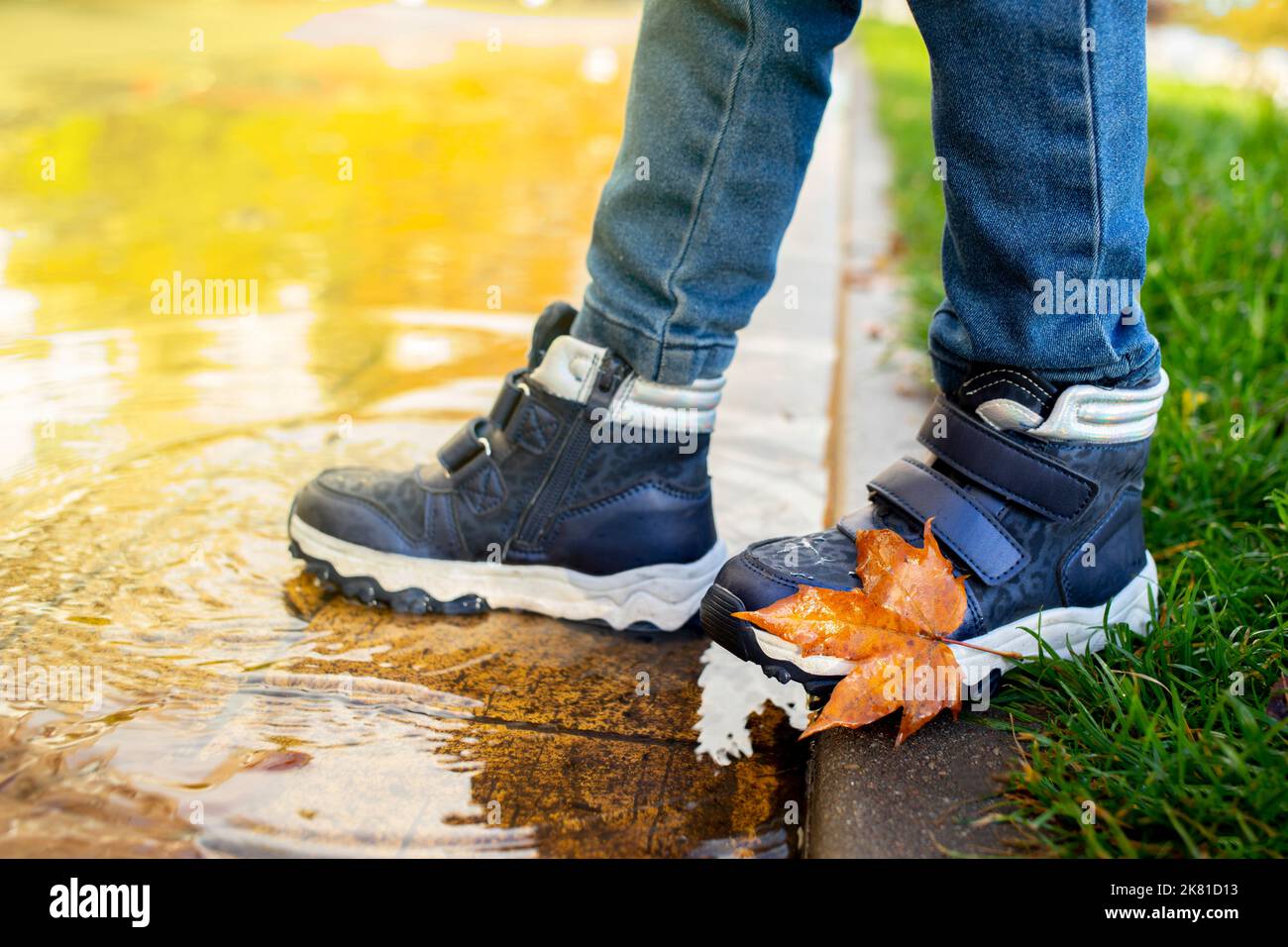Child shoe puddle hi-res stock photography and images - Alamy