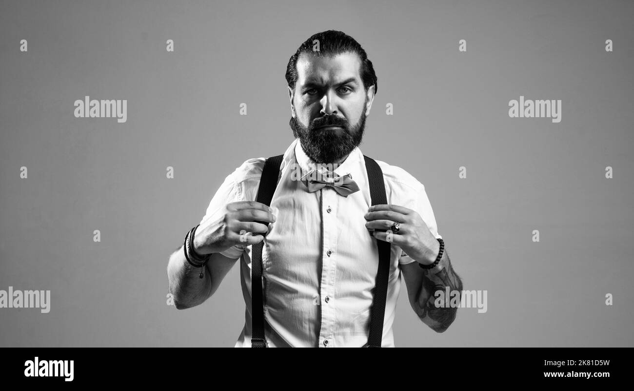 bearded man in suspenders. brutal guy wear bow tie. elegant male ...