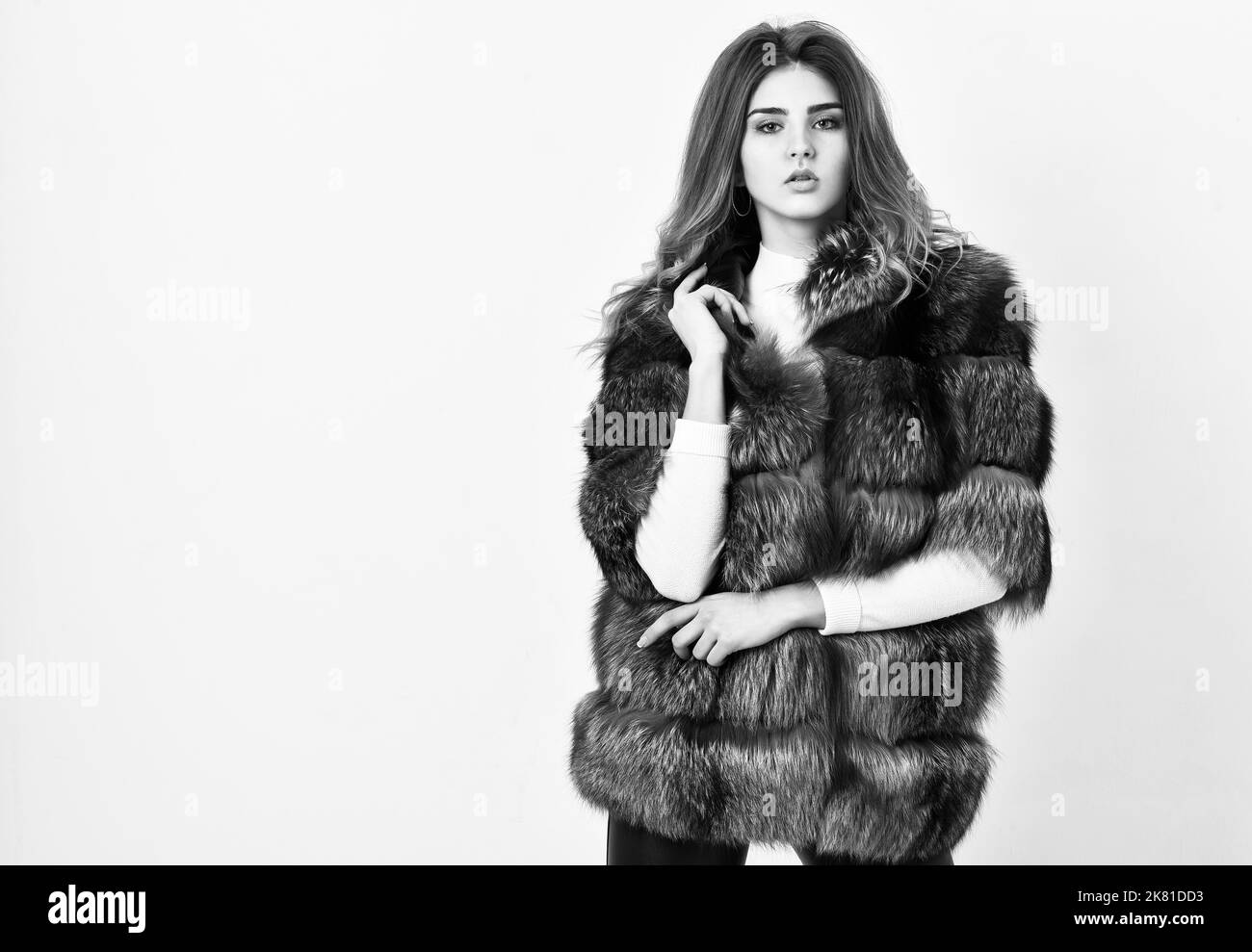 Winter elite luxury clothes. Female brown fur coat. Fur store model ...