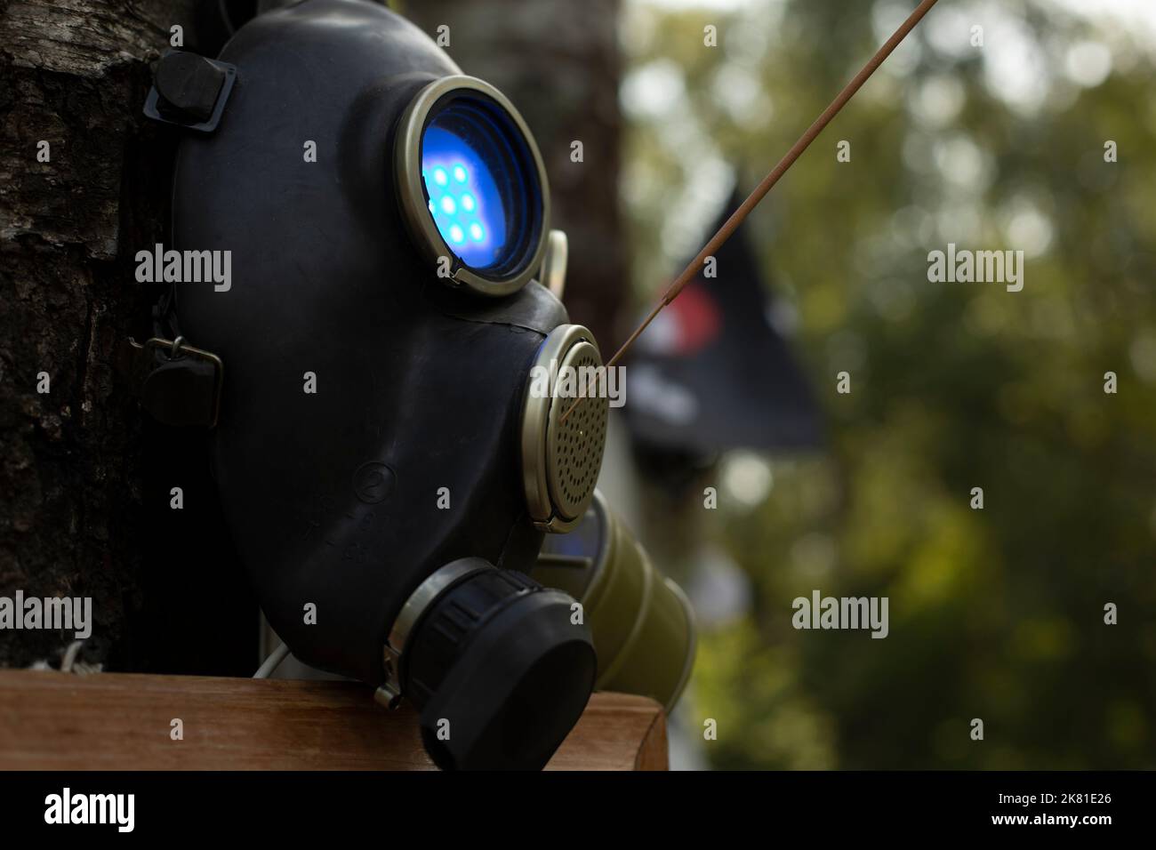 Scary mask. Gas mask with bright eyes. Luminous object. Black gas ...