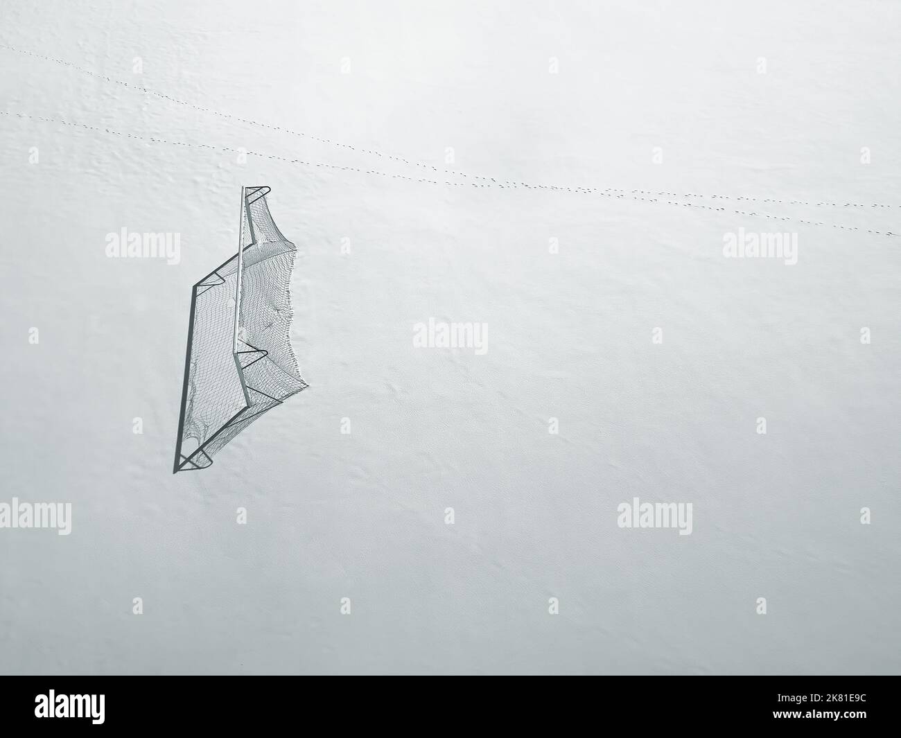 Soccer goal and pitch under snow in winter, aerial view Stock Photo - Alamy