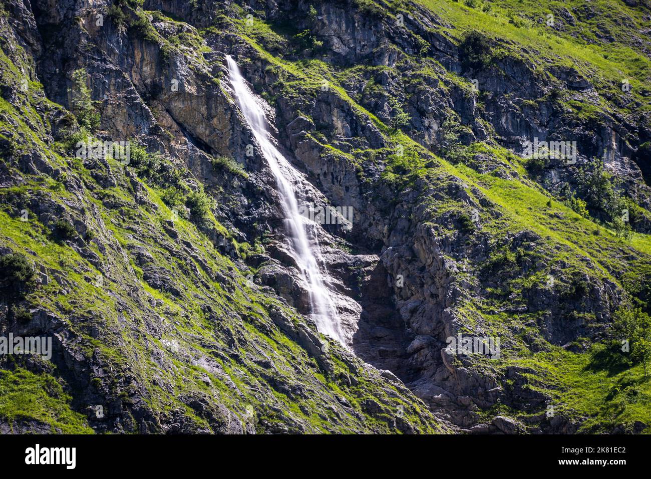 A beautiful waterfall on the green cliff Stock Photo - Alamy