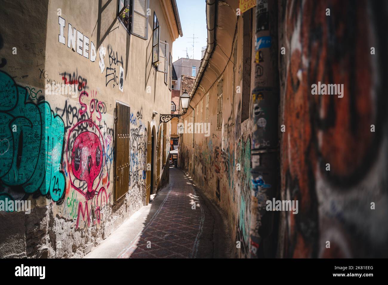 A narrow street with graffiti on the walls in Zagreb, Croatia Stock ...