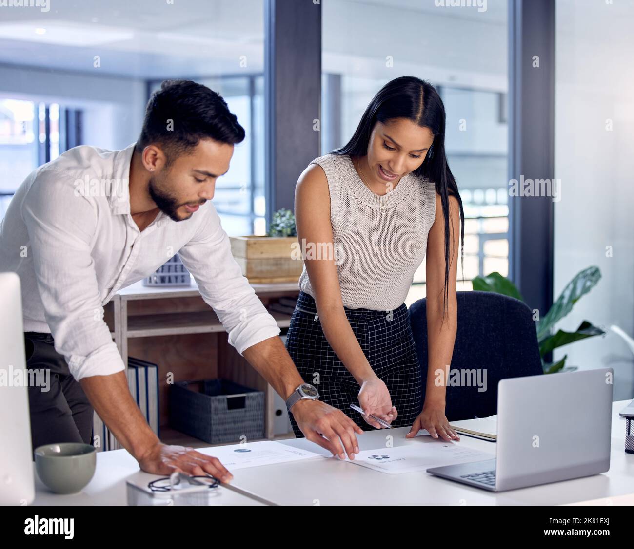 Two young people looking documents hi-res stock photography and images ...