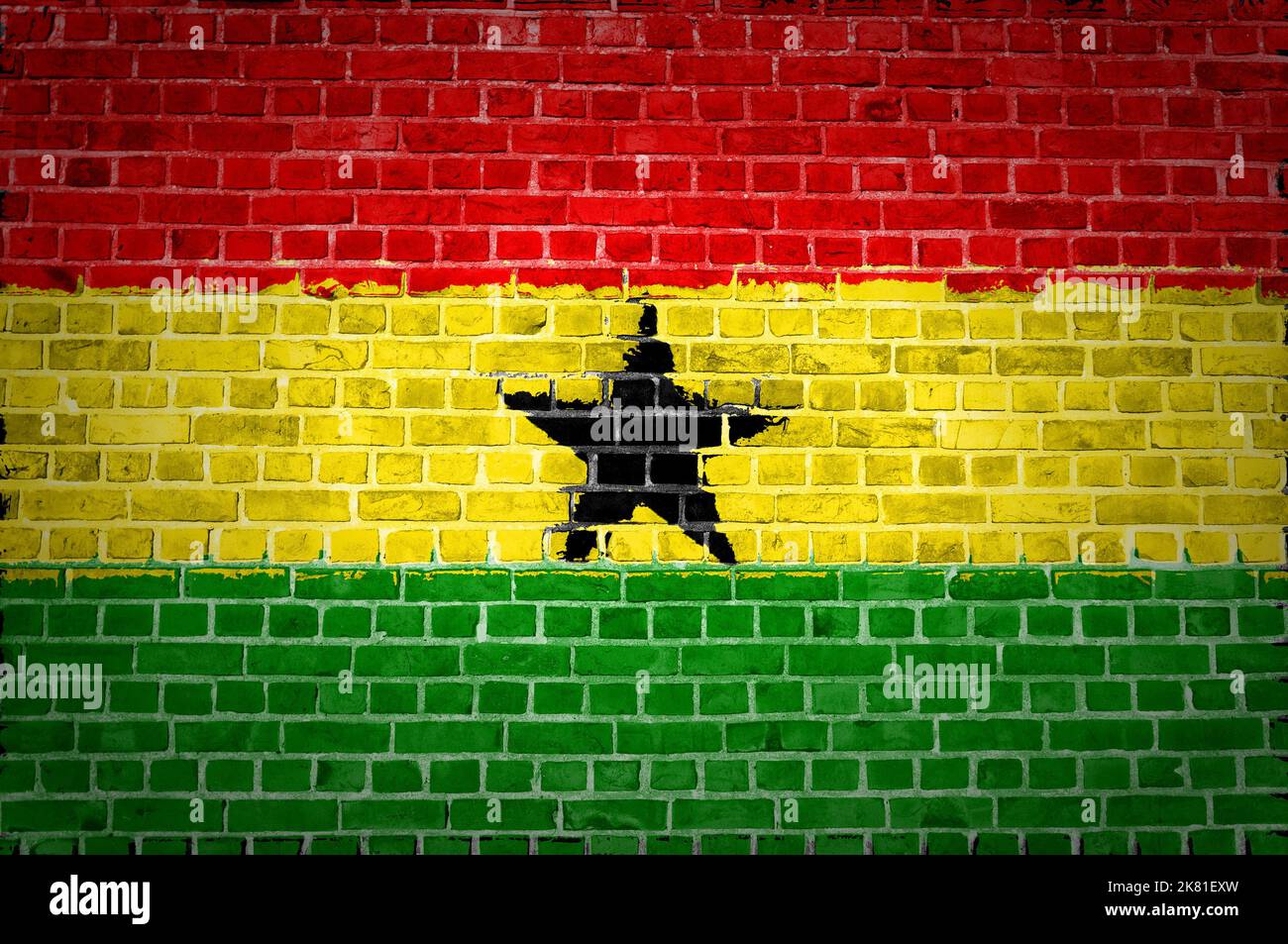 An image of the Ghana flag painted on a brick wall in an urban location ...