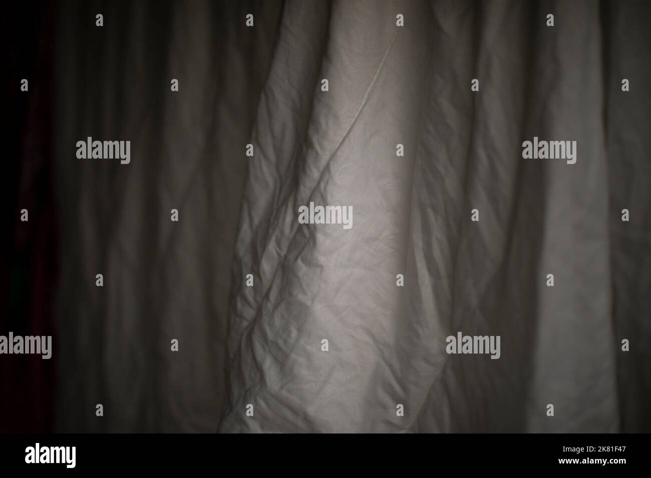 Blanket dries in room. Drying clothes. White linen. Fabric texture ...