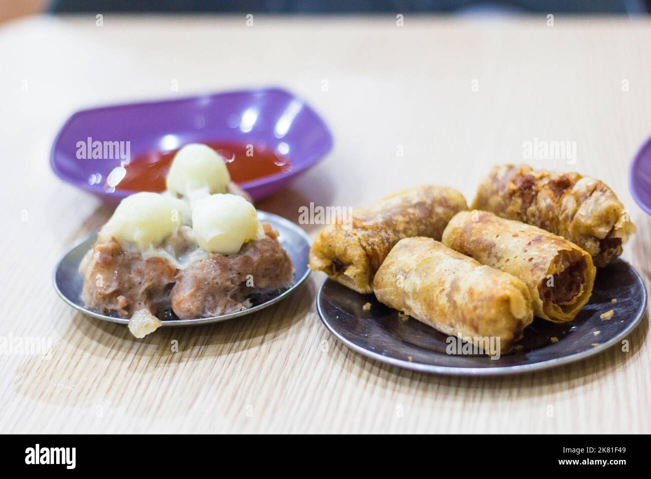 Filipino chinese dimsum consisting of shanghai lumpia and quail egg ...