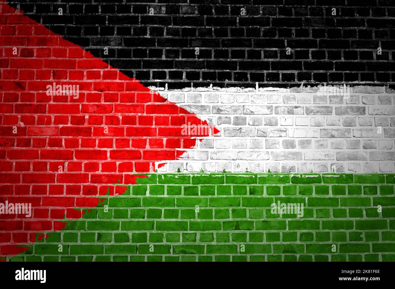 An image of the Palestine flag painted on a brick wall in an urban ...
