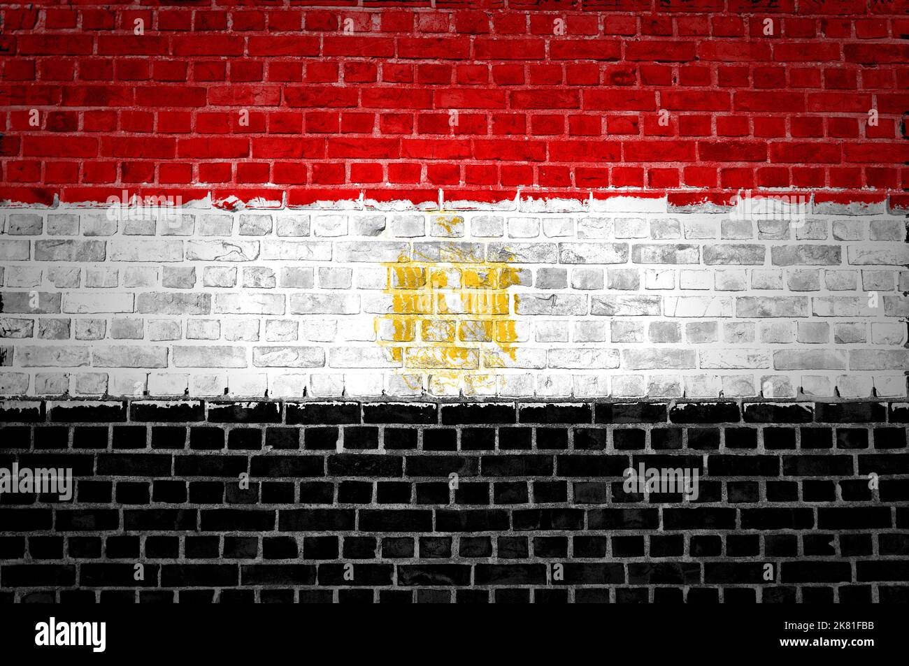 An image of the Egypt flag painted on a brick wall in an urban location ...