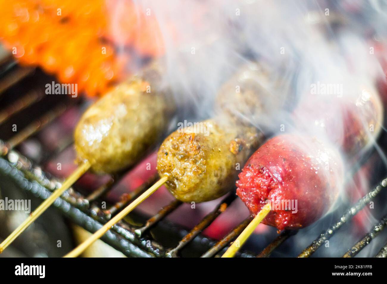 Filipino sausages at a grill stand along a street in Laoag City ...
