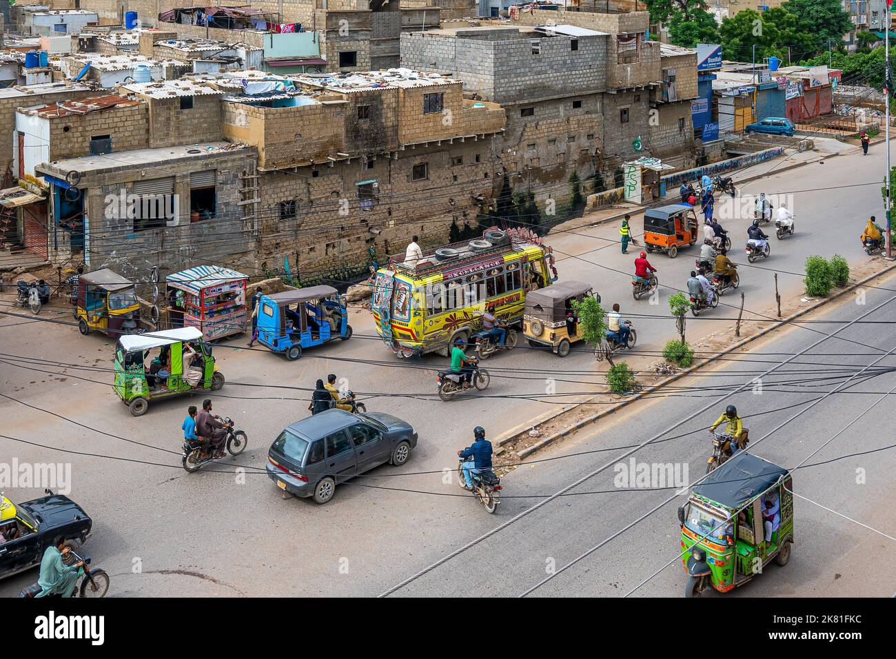 An aerial view of little buses and bikes on Korangi Roads in Karachi ...