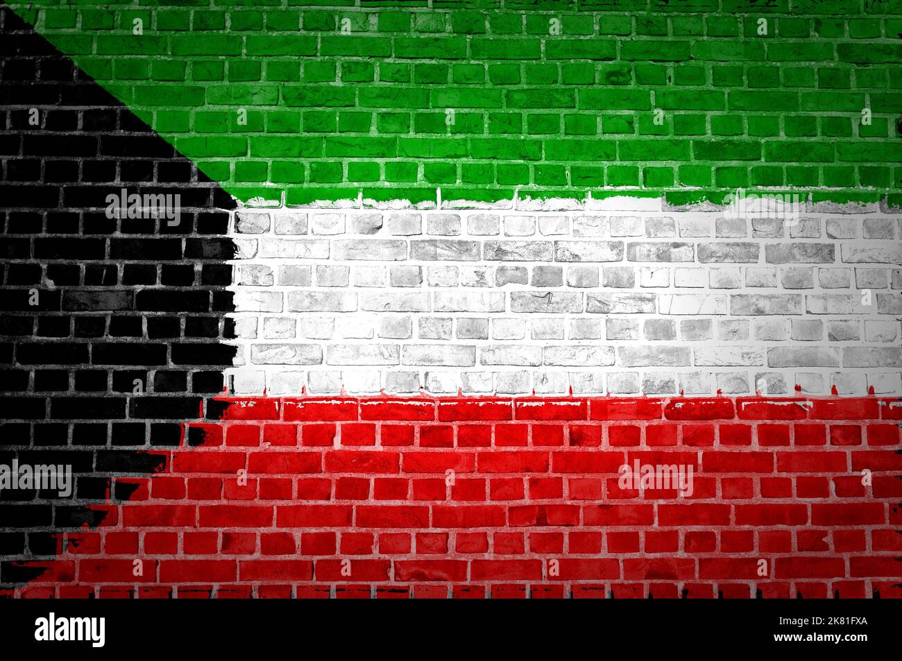 An image of the Kuwait flag painted on a brick wall in an urban ...
