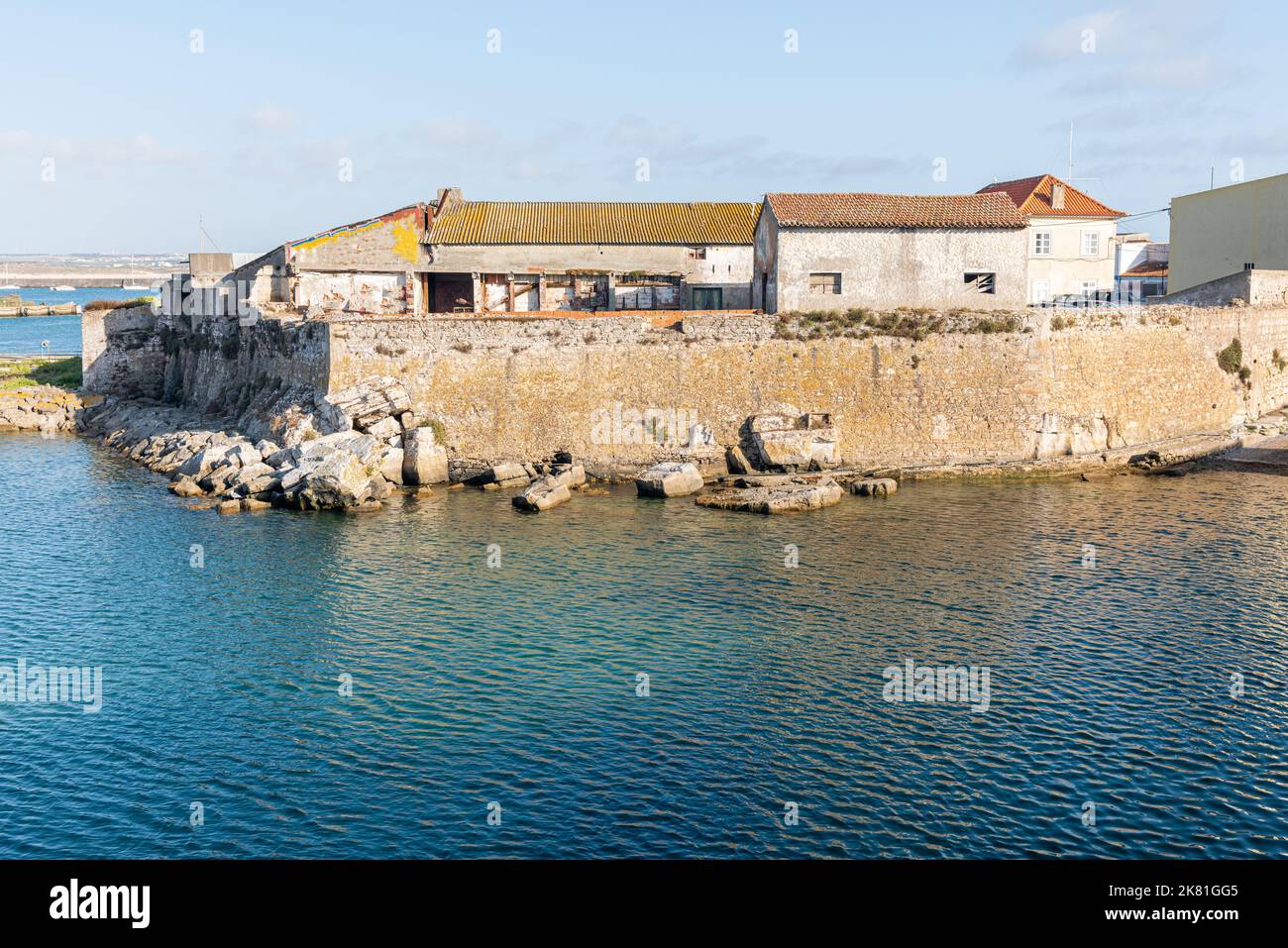 A view of the old waterside walls and buildings under the blue sky in ...