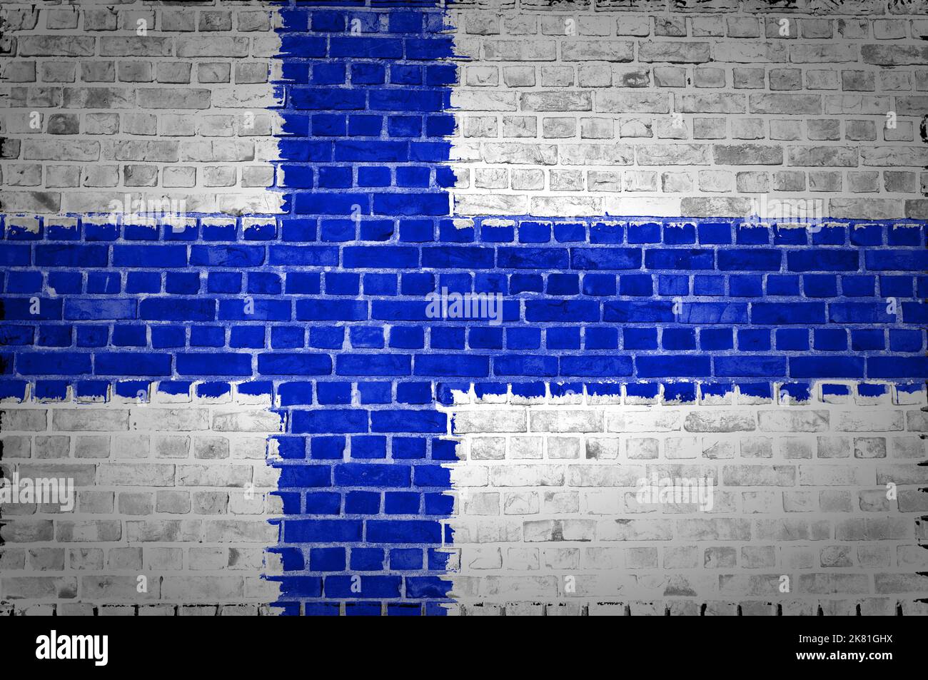 An image of the Finland flag painted on a brick wall in an urban ...