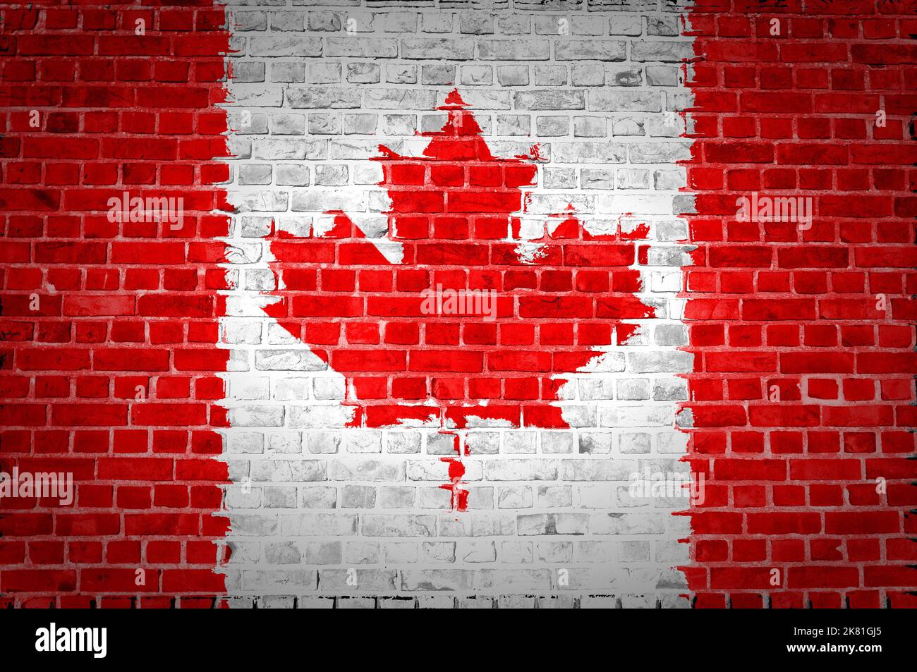 An image of the Canada flag painted on a brick wall in an urban ...