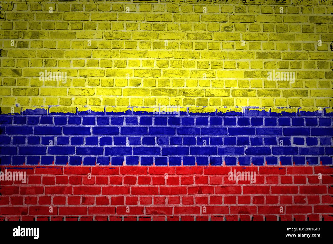 An image of the Colombia flag painted on a brick wall in an urban ...