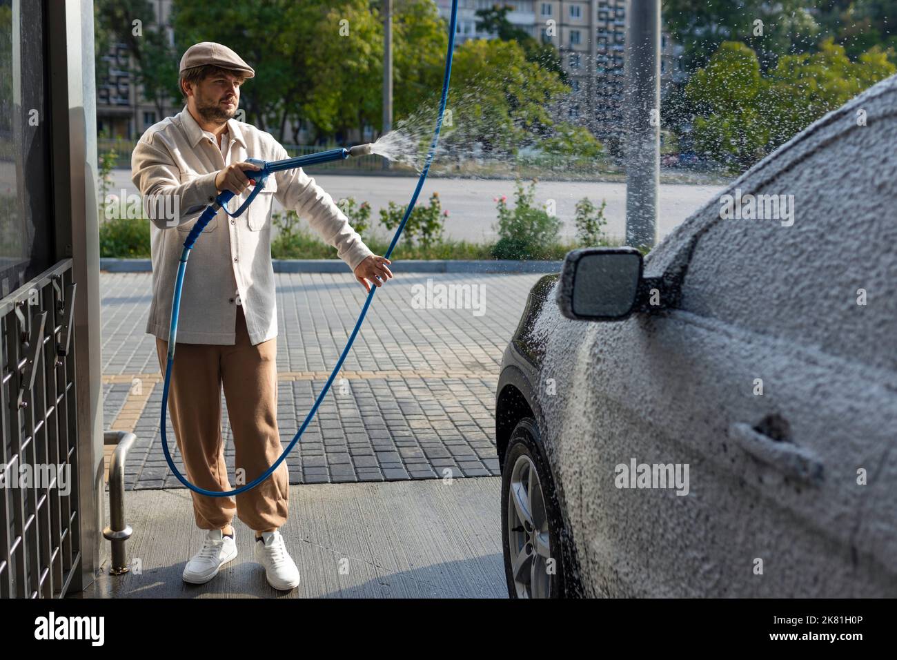 He loves his car. Man washing car Stock Photo - Alamy