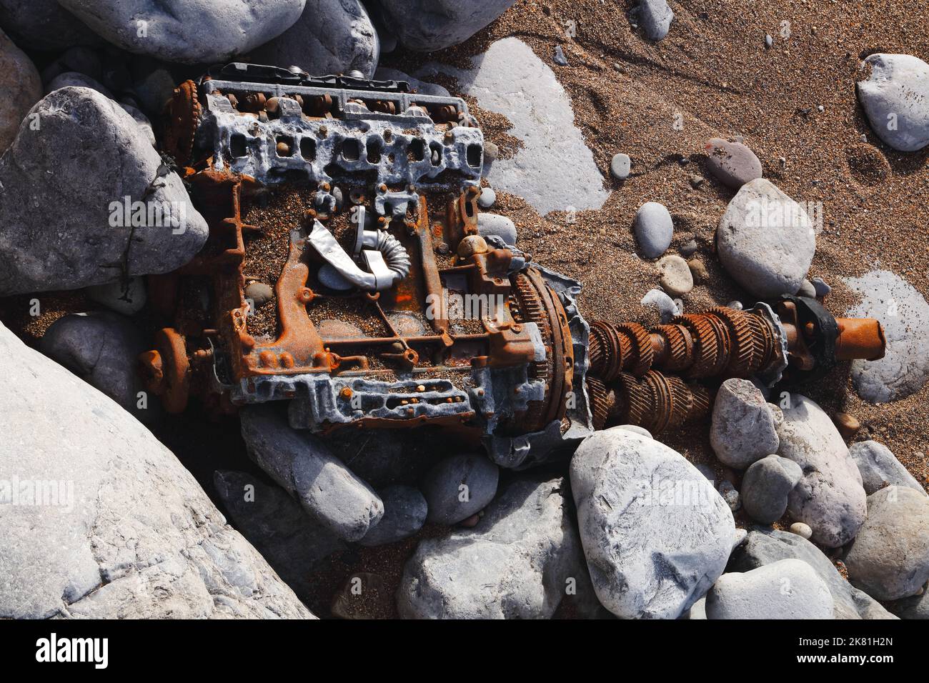 A large engine and what is left of a gear box washed up on the beach in ...
