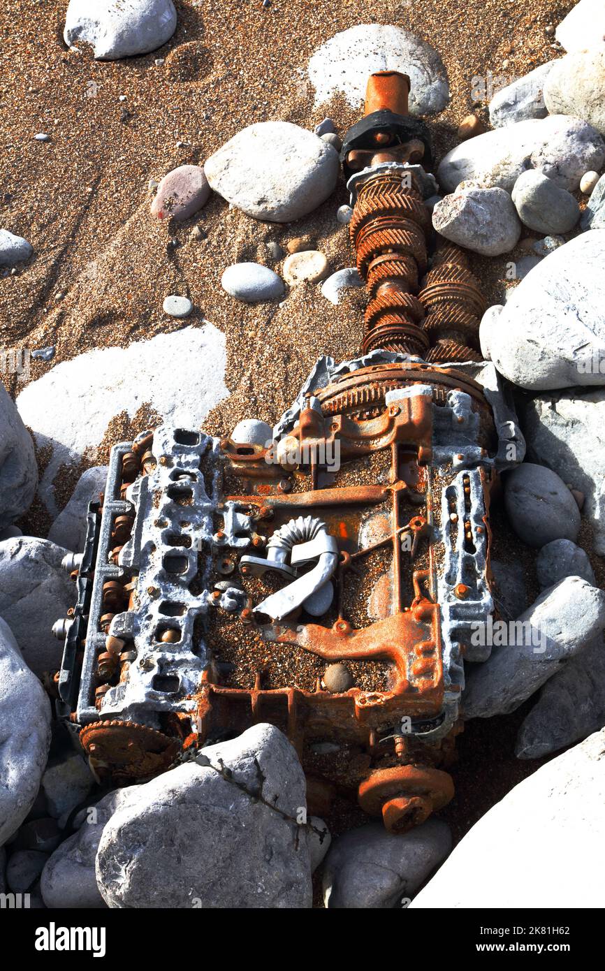 A large engine and what is left of a gear box washed up on the beach in ...