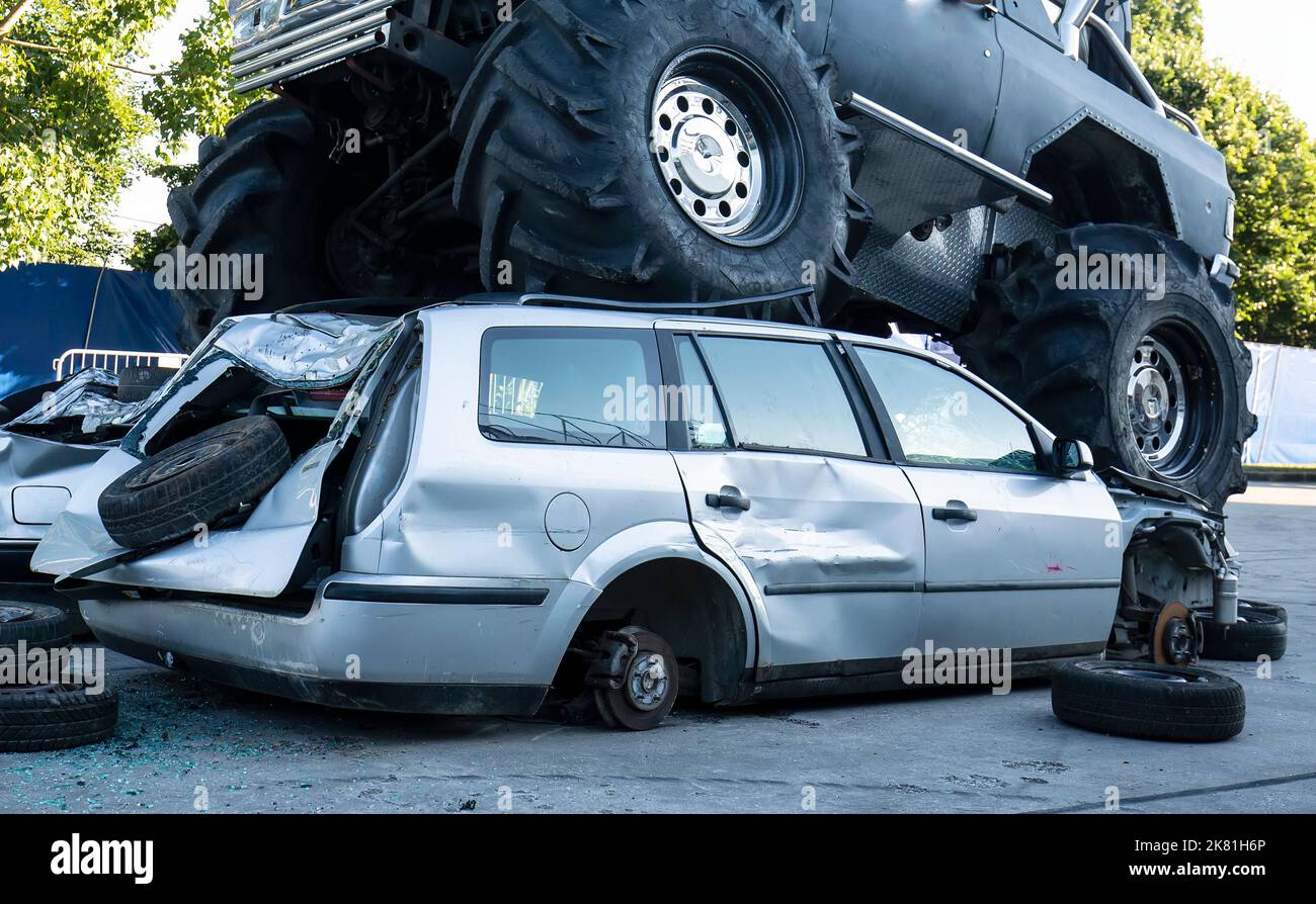 Huge big foot car smash car on monster truck show outdoor Stock Photo ...