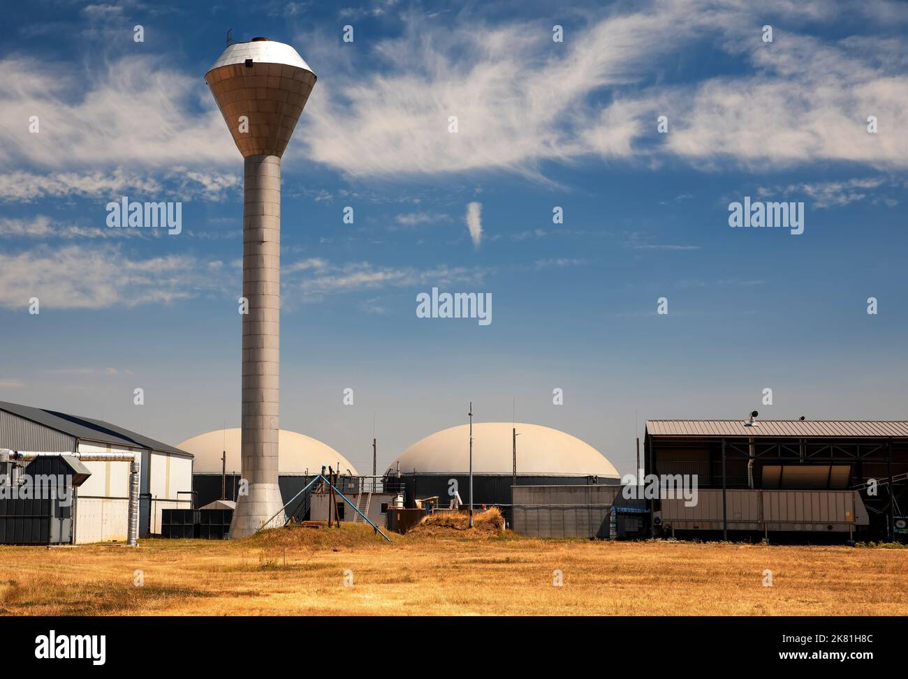 Biogas facility symbol of alternative energy with water tower Stock ...