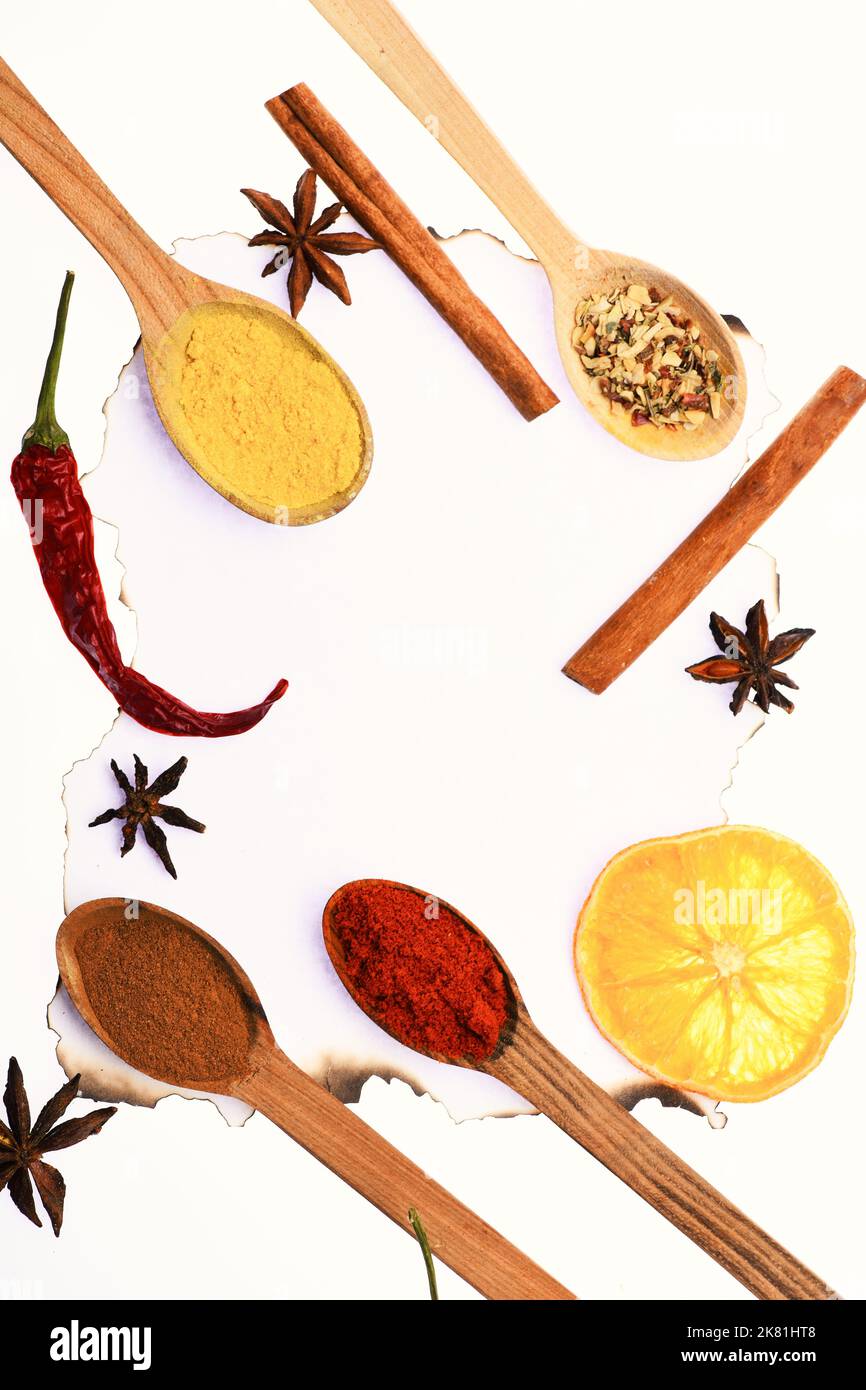 Composition of condiment on paper piece. Set of dry spices Stock Photo ...
