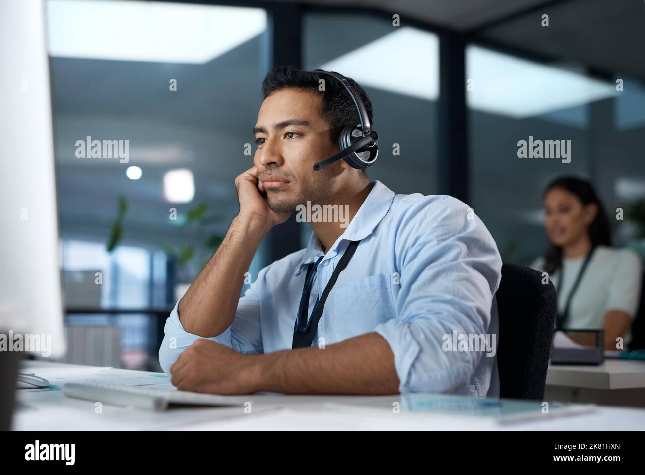 Wheres a call transfer when you need one. a young man using a headset ...