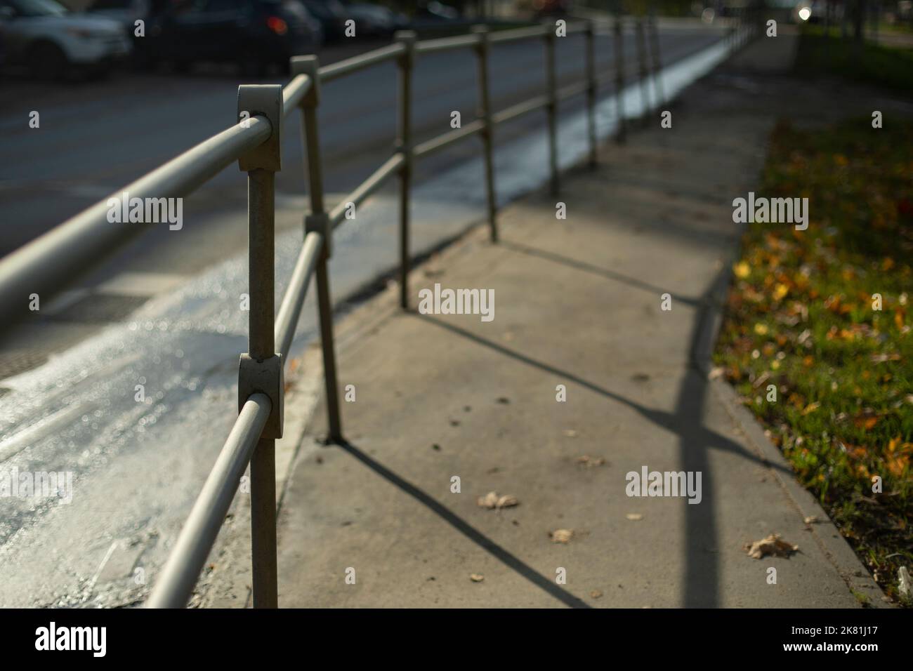 Handrail by road. Pedestrian barrier. Fence along road. Fencing details ...