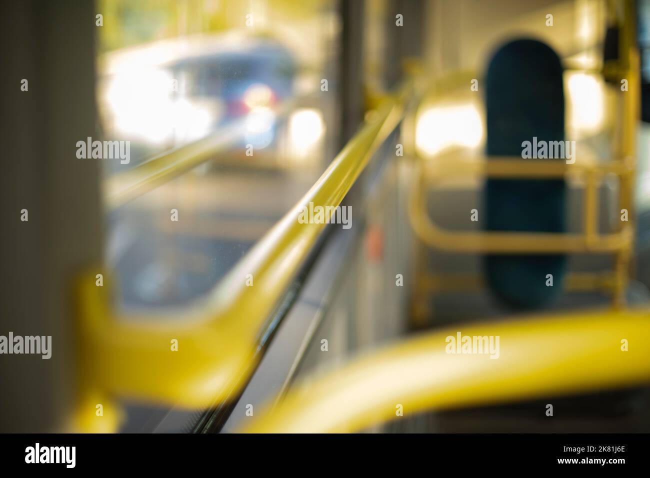 Interior of bus. Yellow handrail in transport. Public transport inside ...
