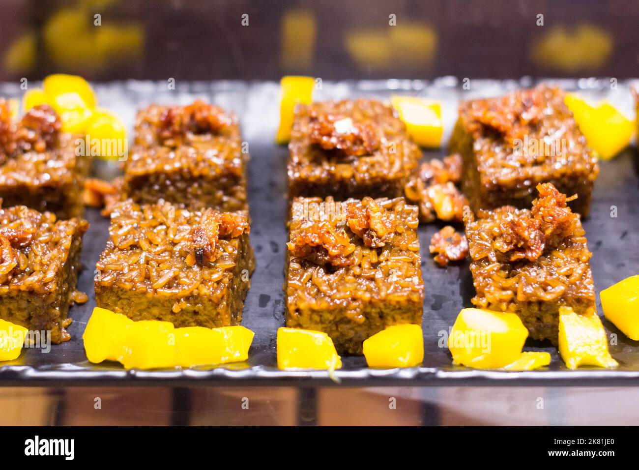Biko squares are Filipino rice cakes made from sticky rice, sugar and ...