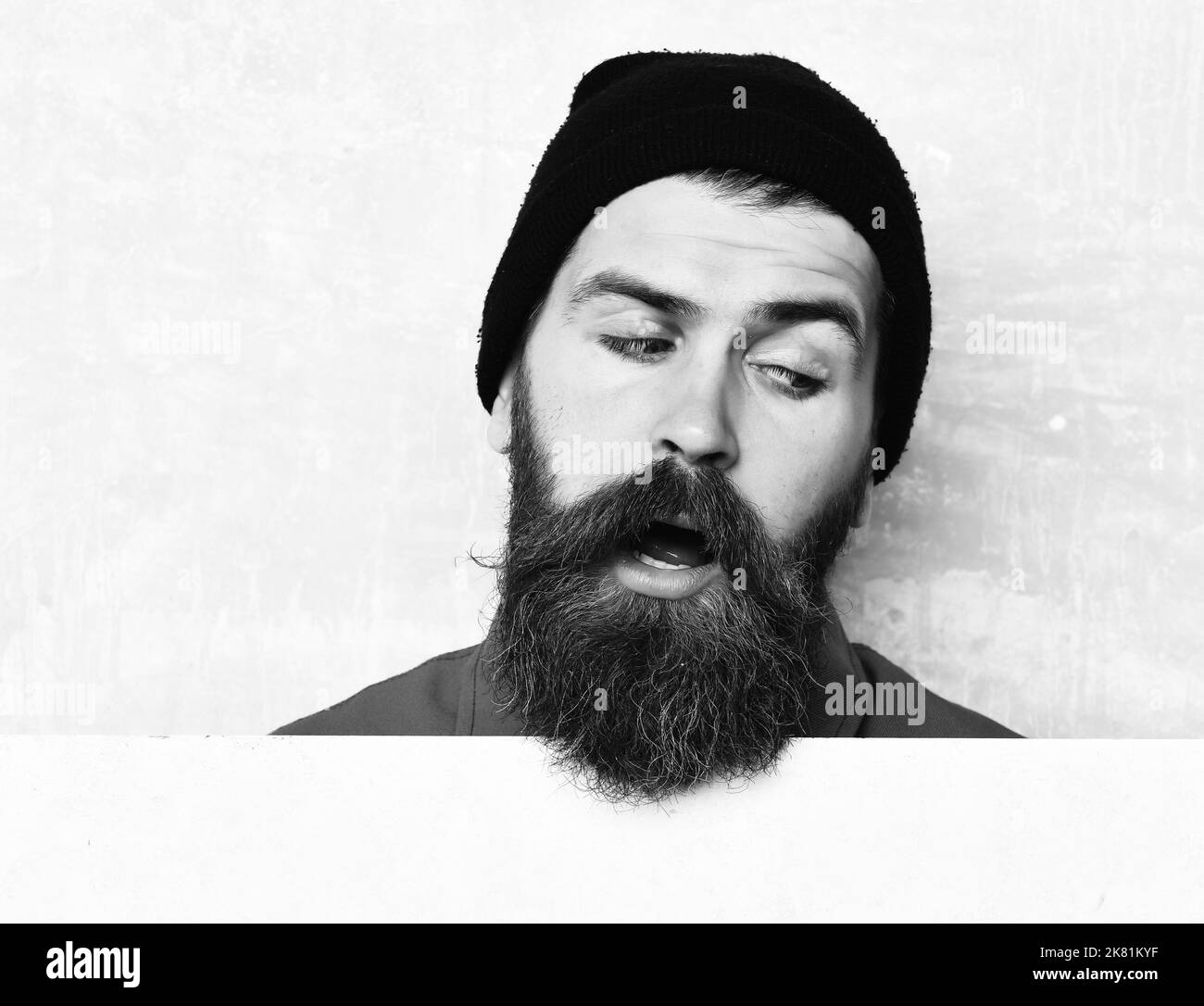 bearded man posing on studio wall background Stock Photo - Alamy