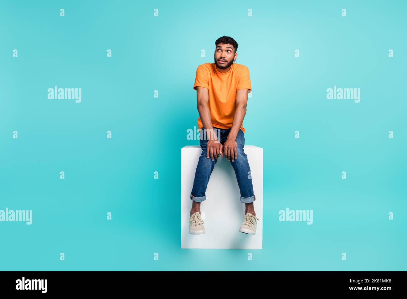 Full size portrait of minded shy person sit podium look interested ...