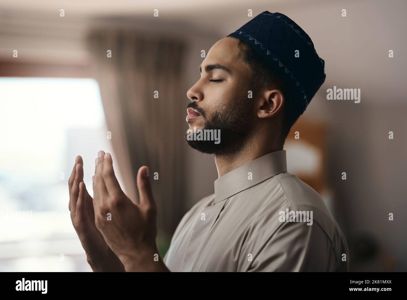 Prayer is the raising of ones heart. a young muslim man praying in the ...