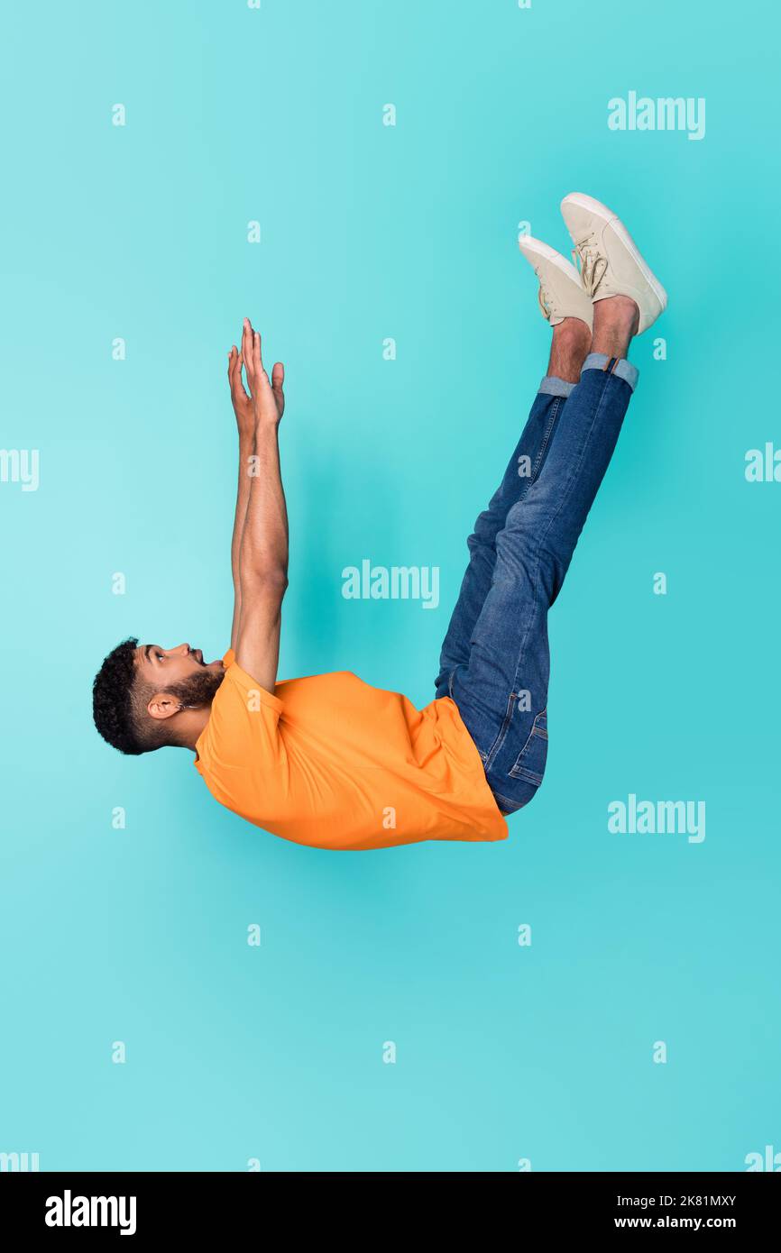 Vertical full size photo of shocked person falling look up empty space ...