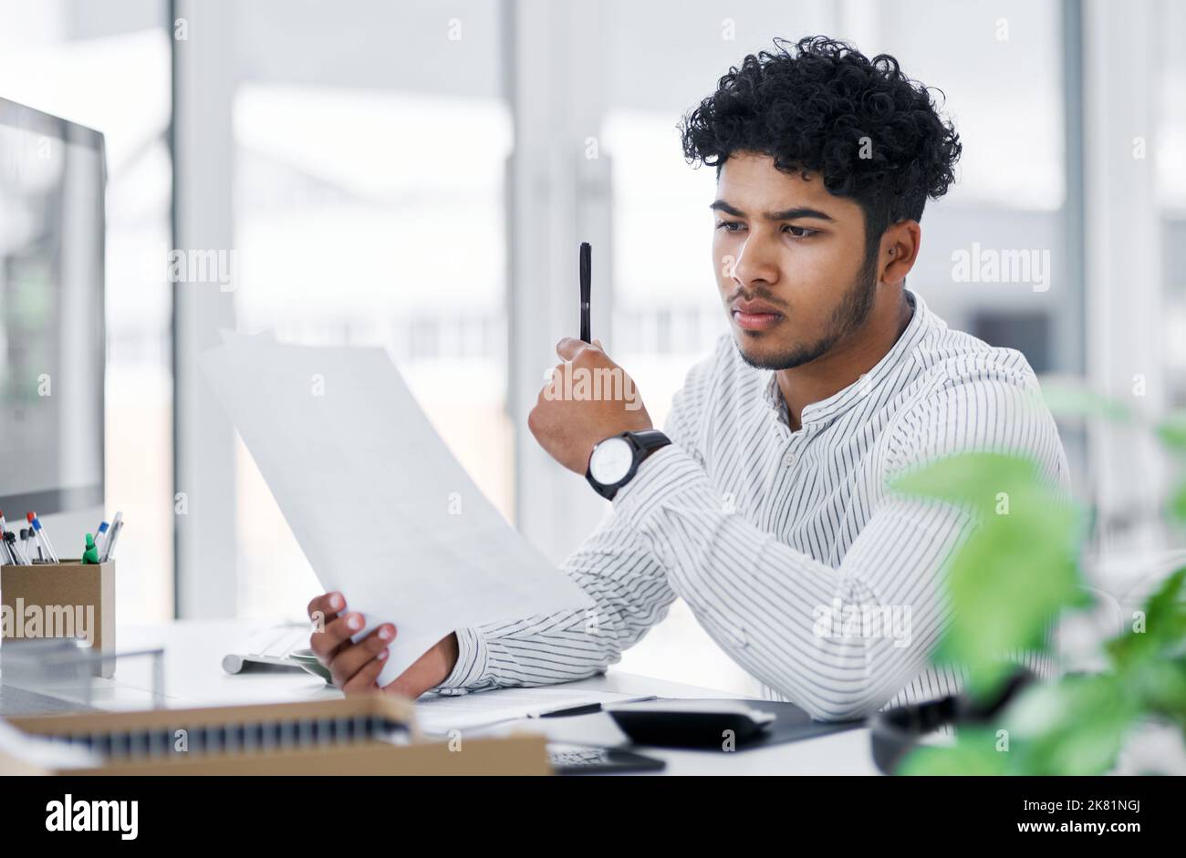 Businessman going over report hi-res stock photography and images - Alamy