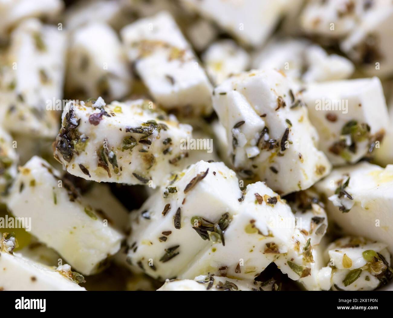 Dice sliced greek feta cheese ith spices Stock Photo - Alamy