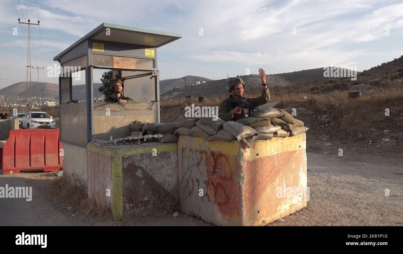 NABLUS, WEST BANK - OCTOBER 19: Israeli soldiers stand guard behind ...