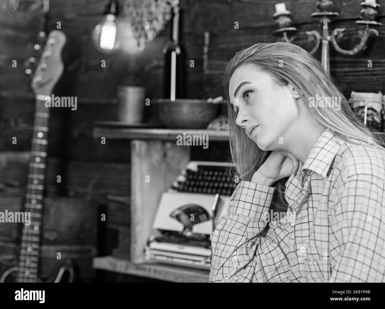 Girl in casual outfit in wooden vintage interior. Girl tomboy spend ...