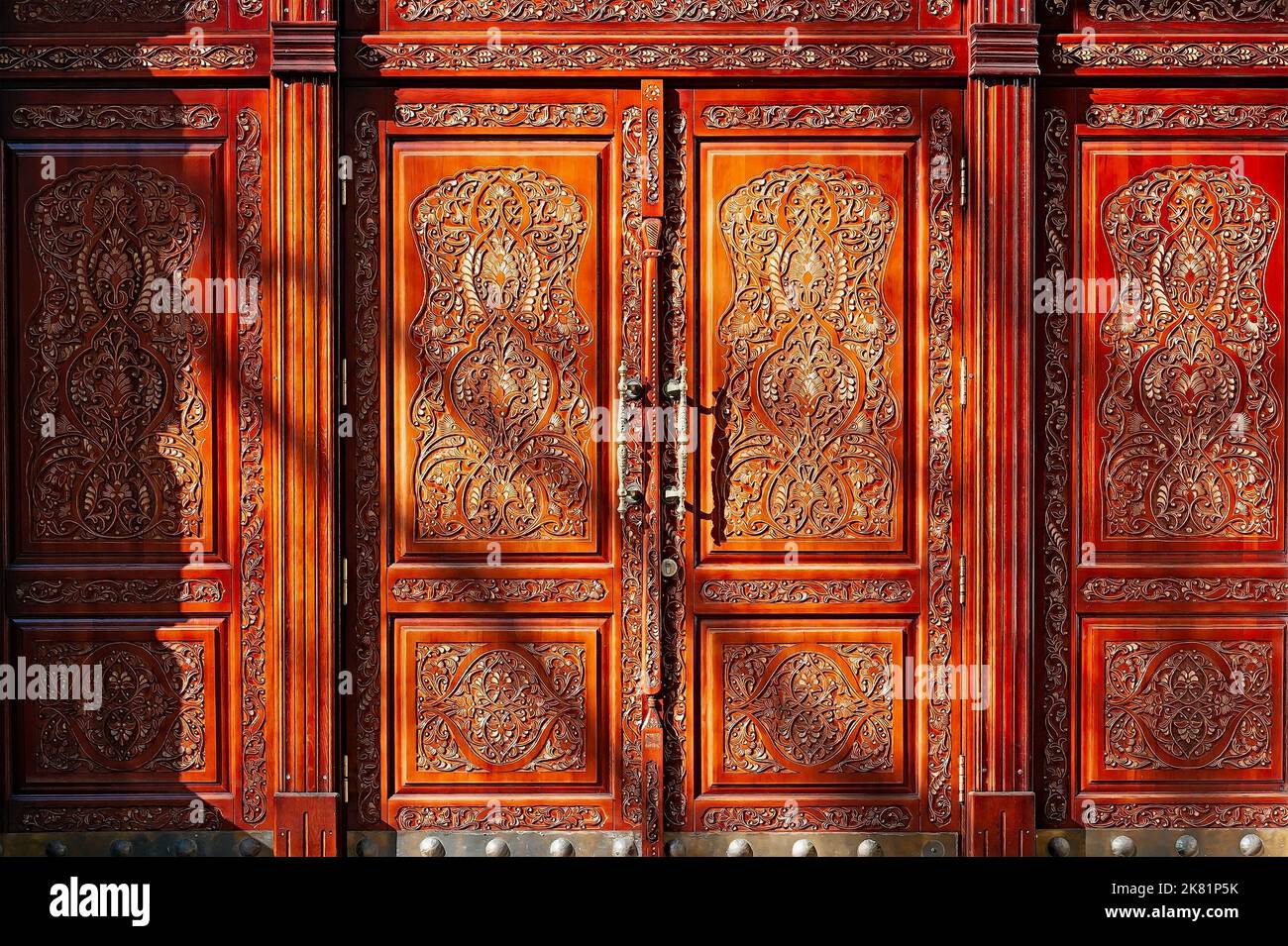 Red Ornate Doors With Golden Oriental Pattern In Kyiv Ukraine Stock red-ornate-doors-with-golden-oriental-pattern-in-kyiv-ukraine-stock