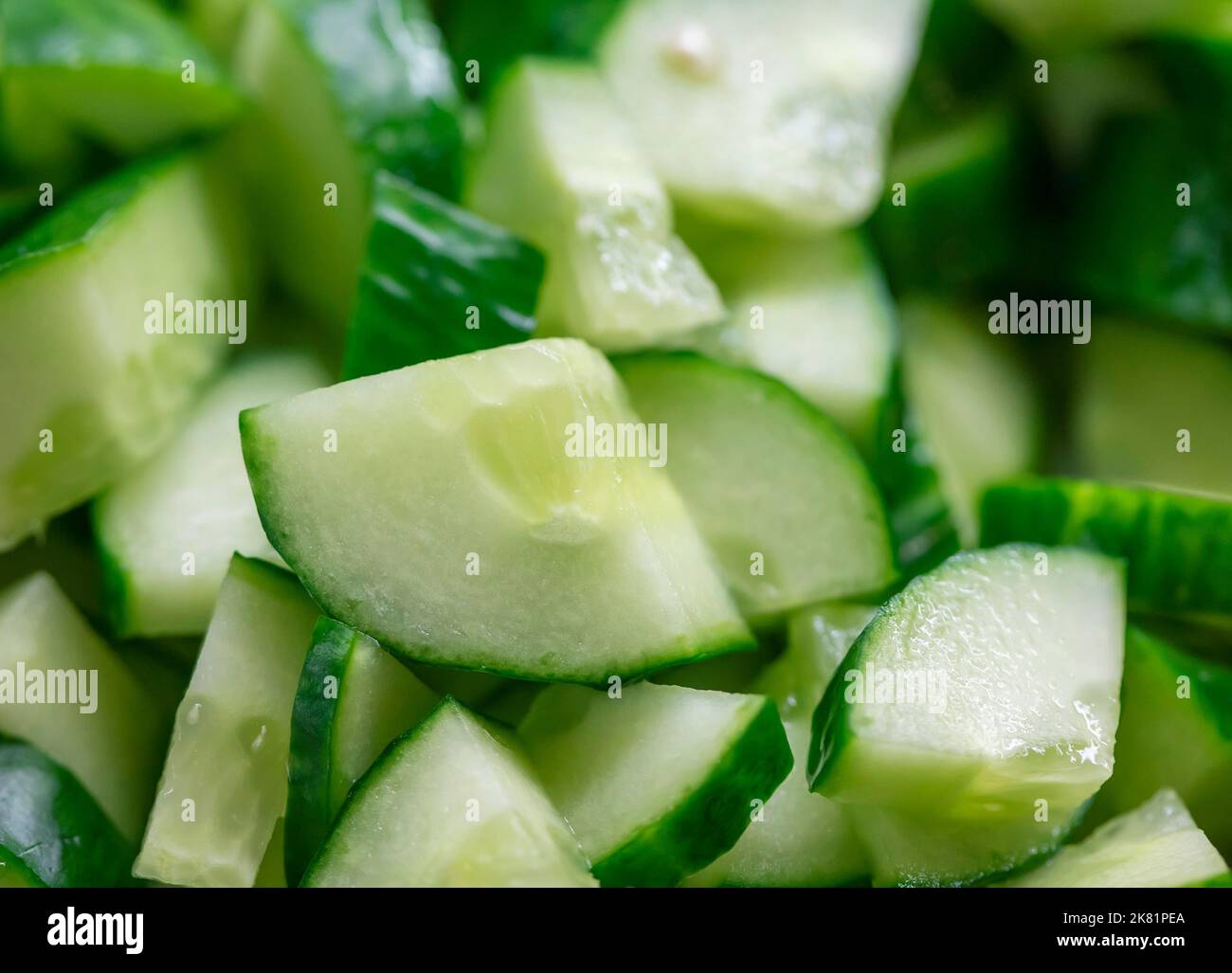 Juicy sliced pieces of cucumber Stock Photo - Alamy