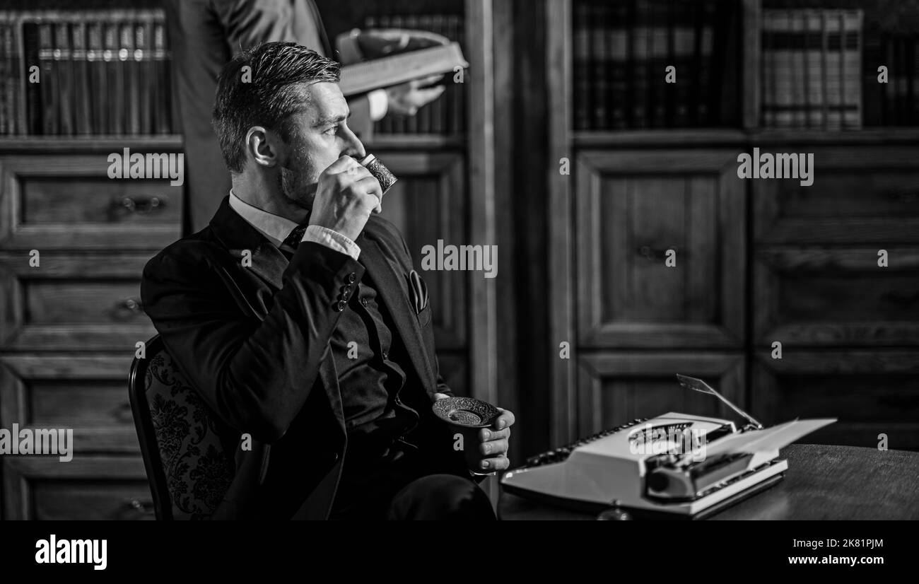 Men in suits in library with antique books on background Stock Photo ...