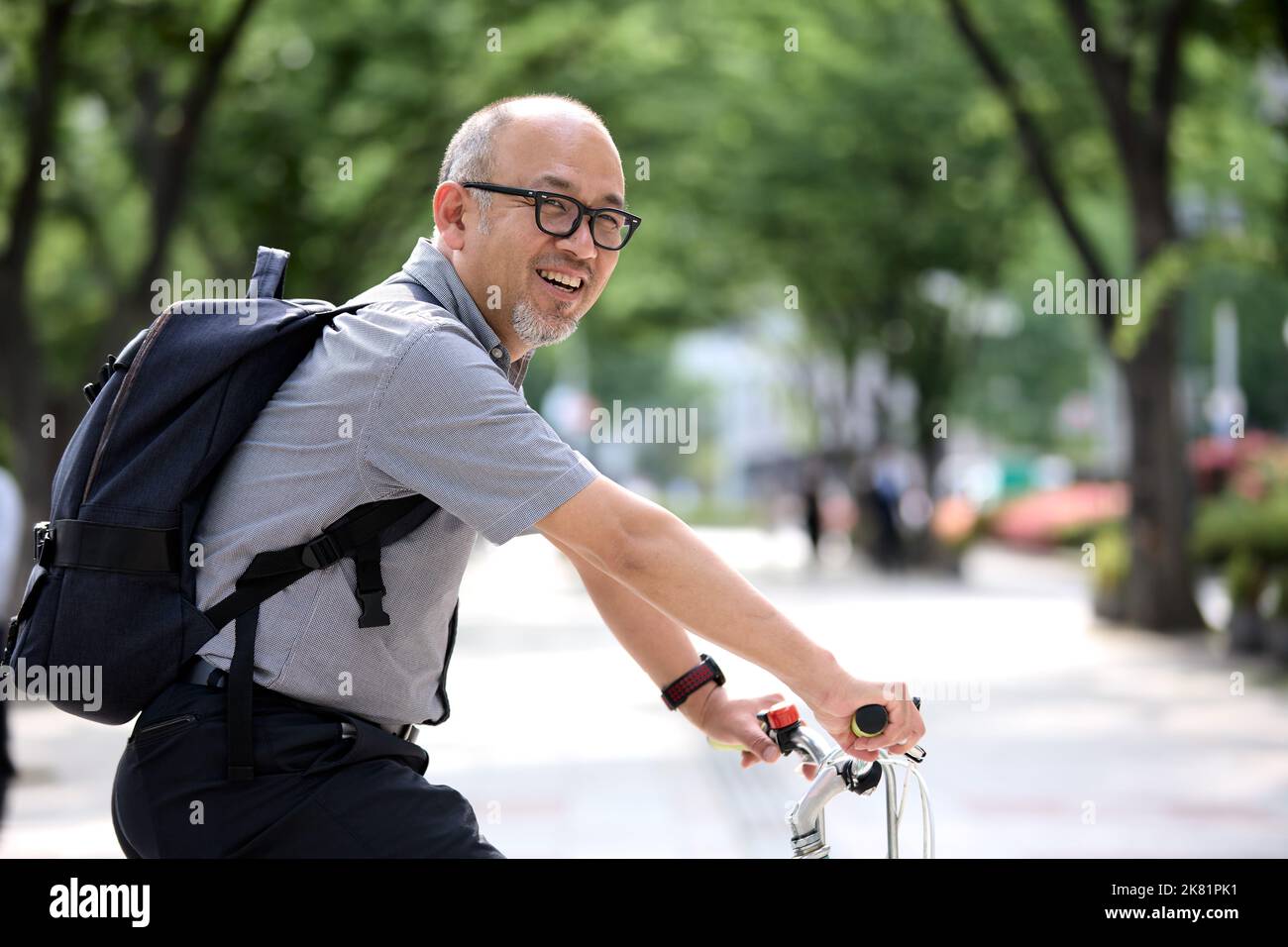 Japanese man riding a bike hi-res stock photography and images - Alamy