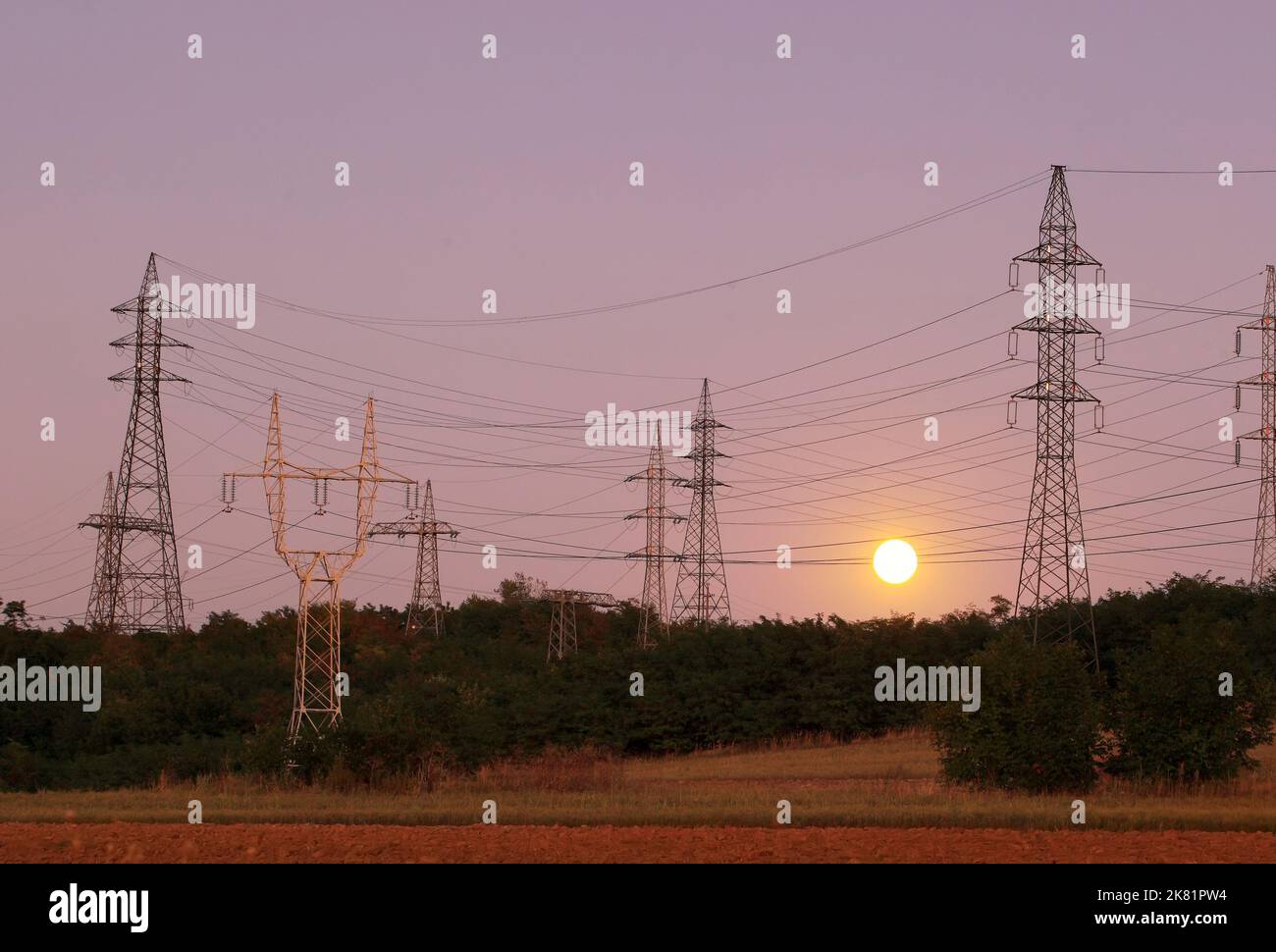 Electric towers in beautiful landscape Stock Photo - Alamy
