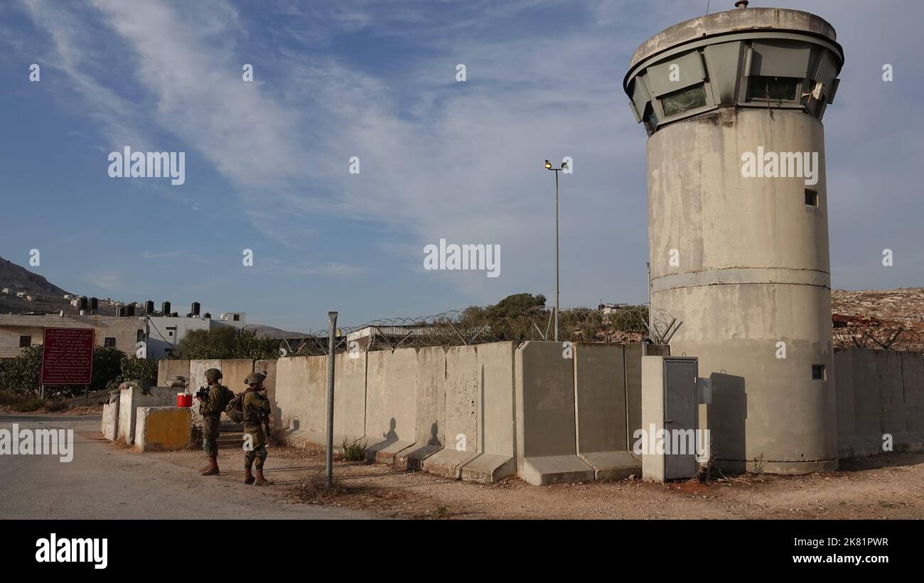 Israeli soldiers stand guard in the military Awarta checkpoint one of ...