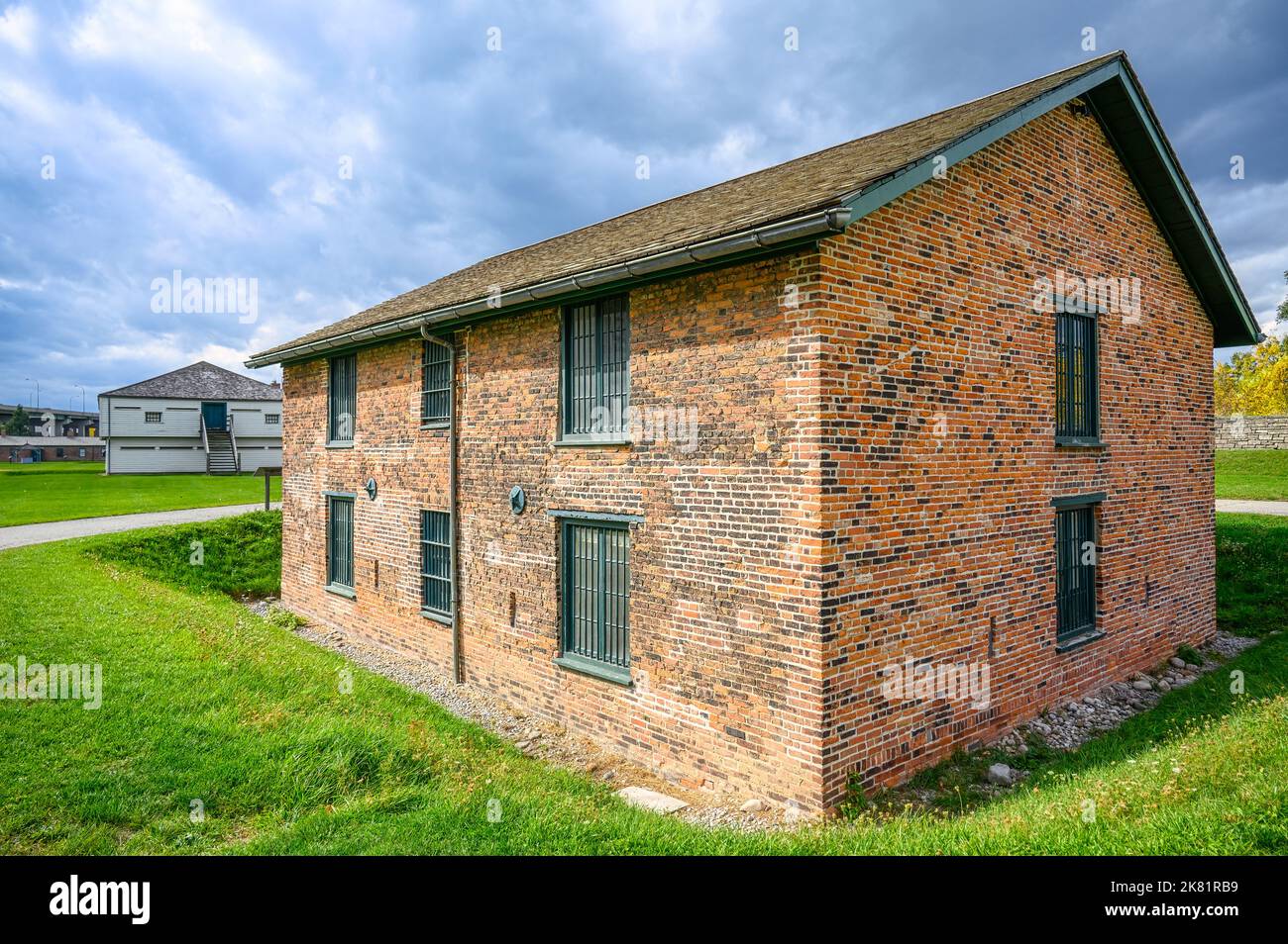 Building exterior with colonial brick walls and grille in the windows ...