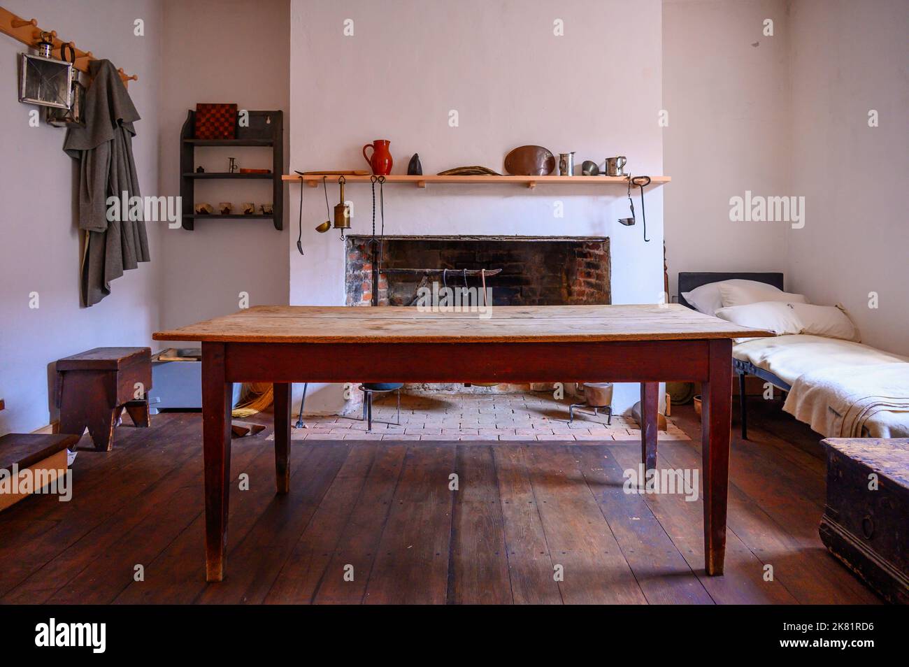 A rustic table and a fireplace inside a colonial room. Fort York is a ...